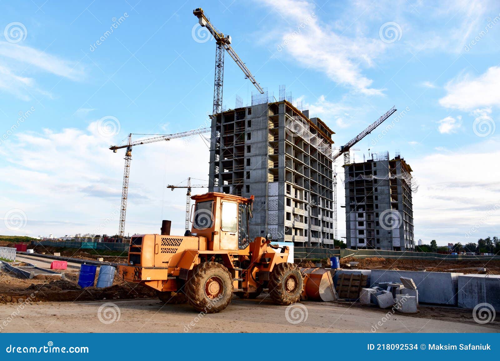 Wheel Loader with a Bucket at Construction. Heavy Machinery for Loading ...