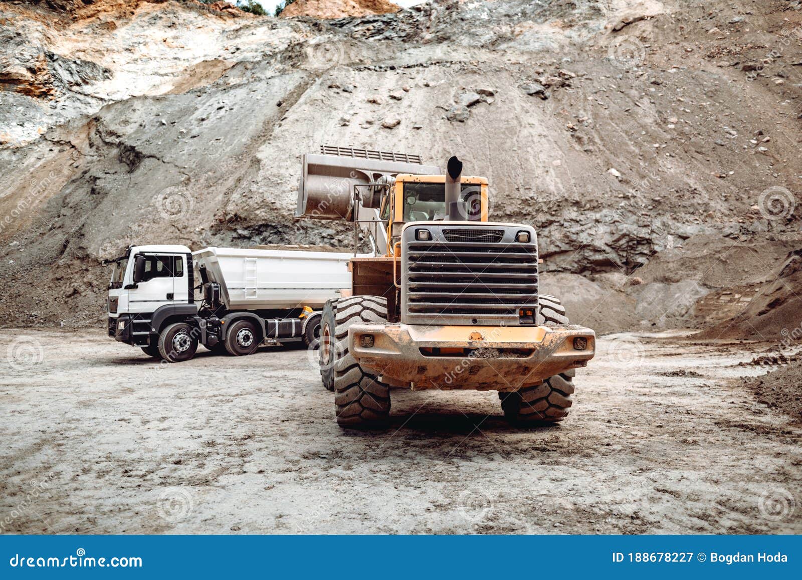 Wheel Loader Bulldozer with Blade Loading Dumper Trucks on Construction ...