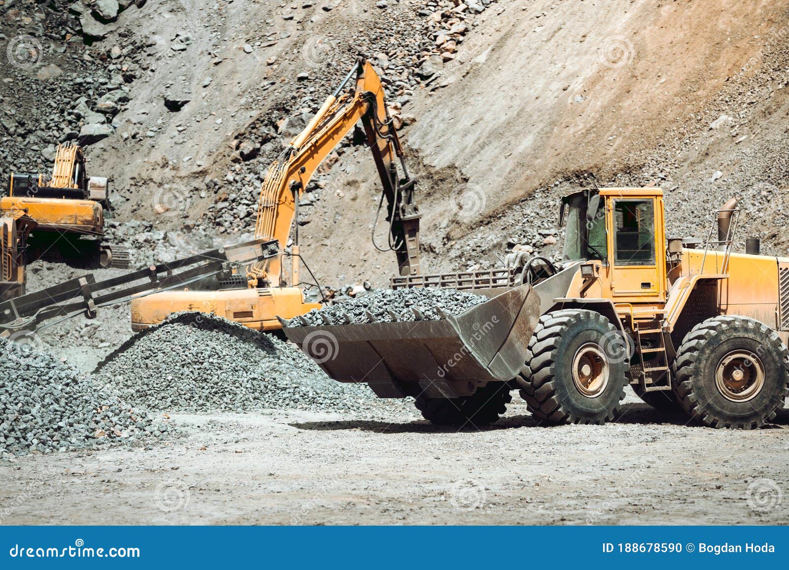 Large Wheel Loader on Construction Site Transporting and Loading Gravel ...
