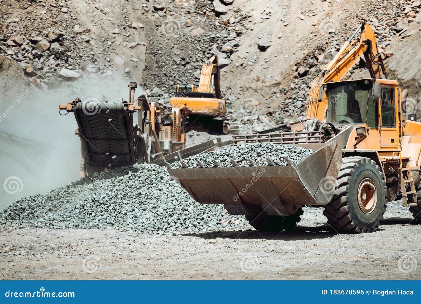 Large Wheel Loader on Construction Site Transporting and Loading Gravel ...