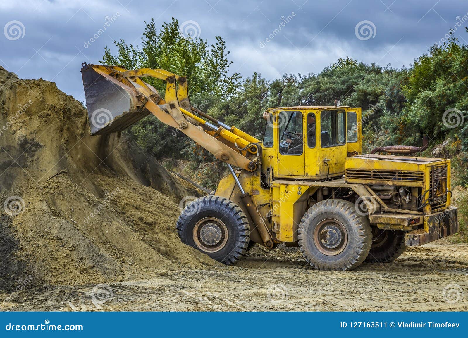 Wheel Loader Excavator with Backhoe Unloading Sand at Eathmoving Works ...
