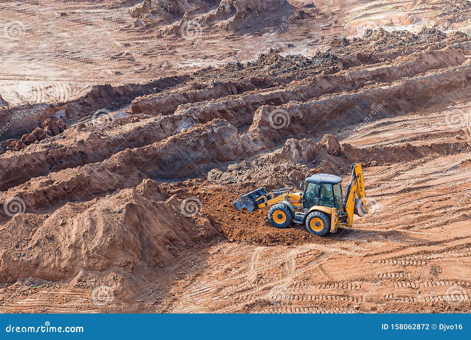 Wheel Loader Excavator Machine Working in Construction Site. Wheel ...