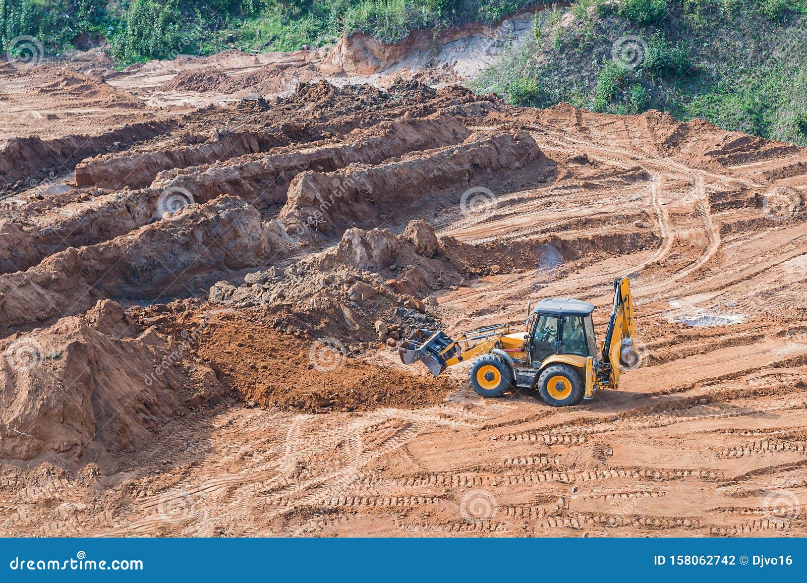 Wheel Loader Excavator Machine Working in Construction Site. Wheel ...