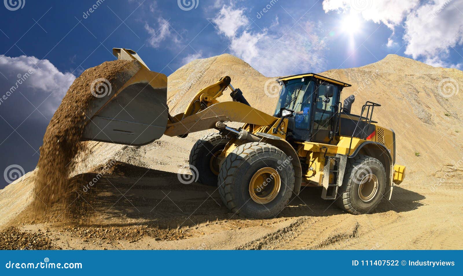 Wheel Loader in a Gravel Pit during Mining - Heavy Construction ...