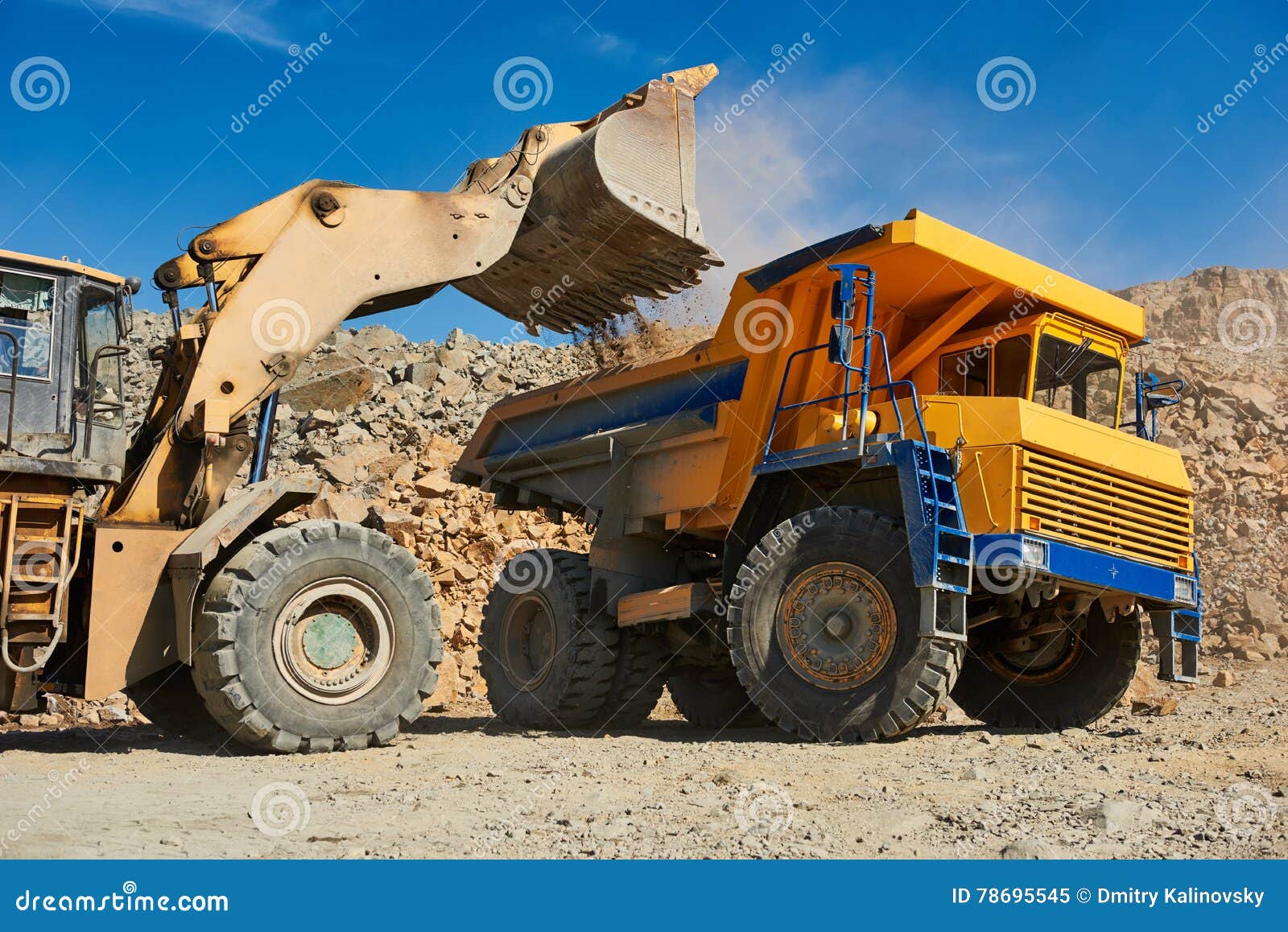 Wheel Loader Loading Ore into Dump Truck at Opencast Stock Image ...