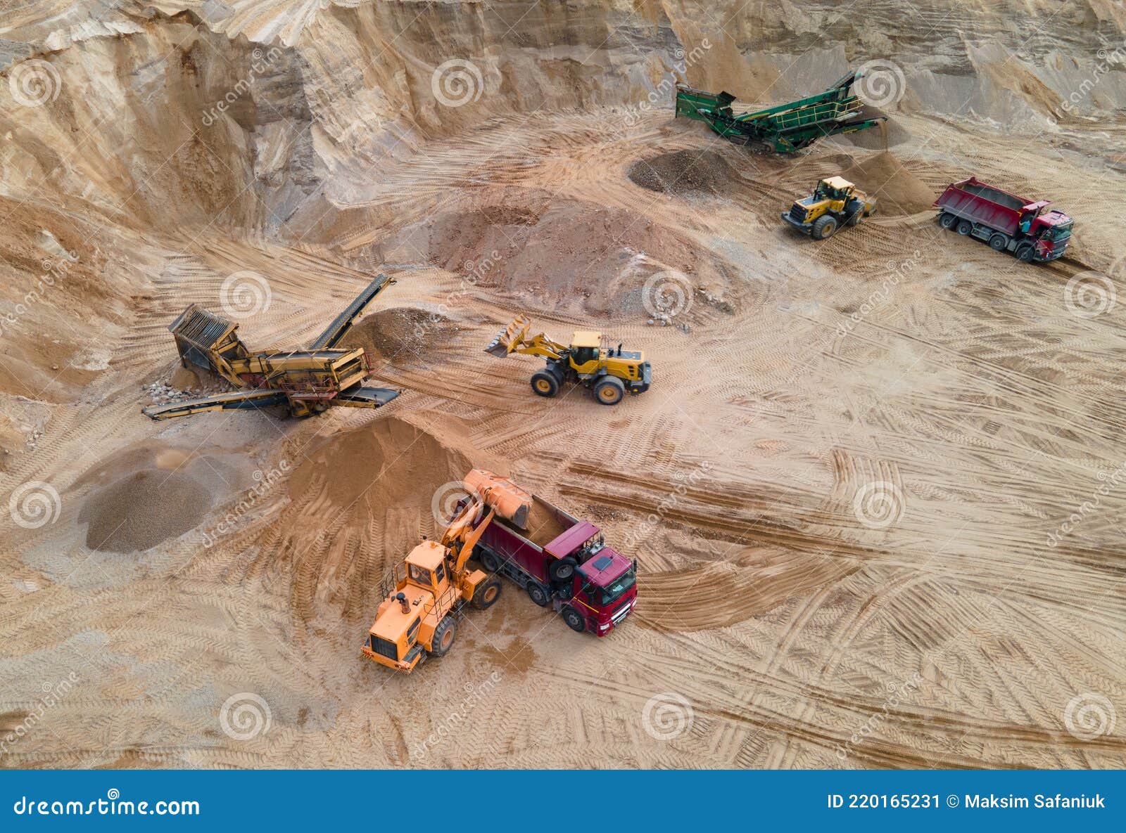 Wheel Loader Loading Sand into Dump Truck in Open Pit. Arial View of ...