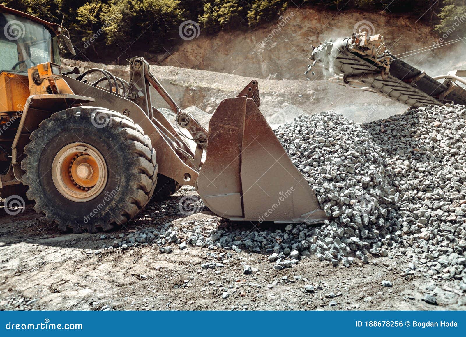 Wheel Loader Machine Unloading Rocks In The Open Pit Mine And Ore ...