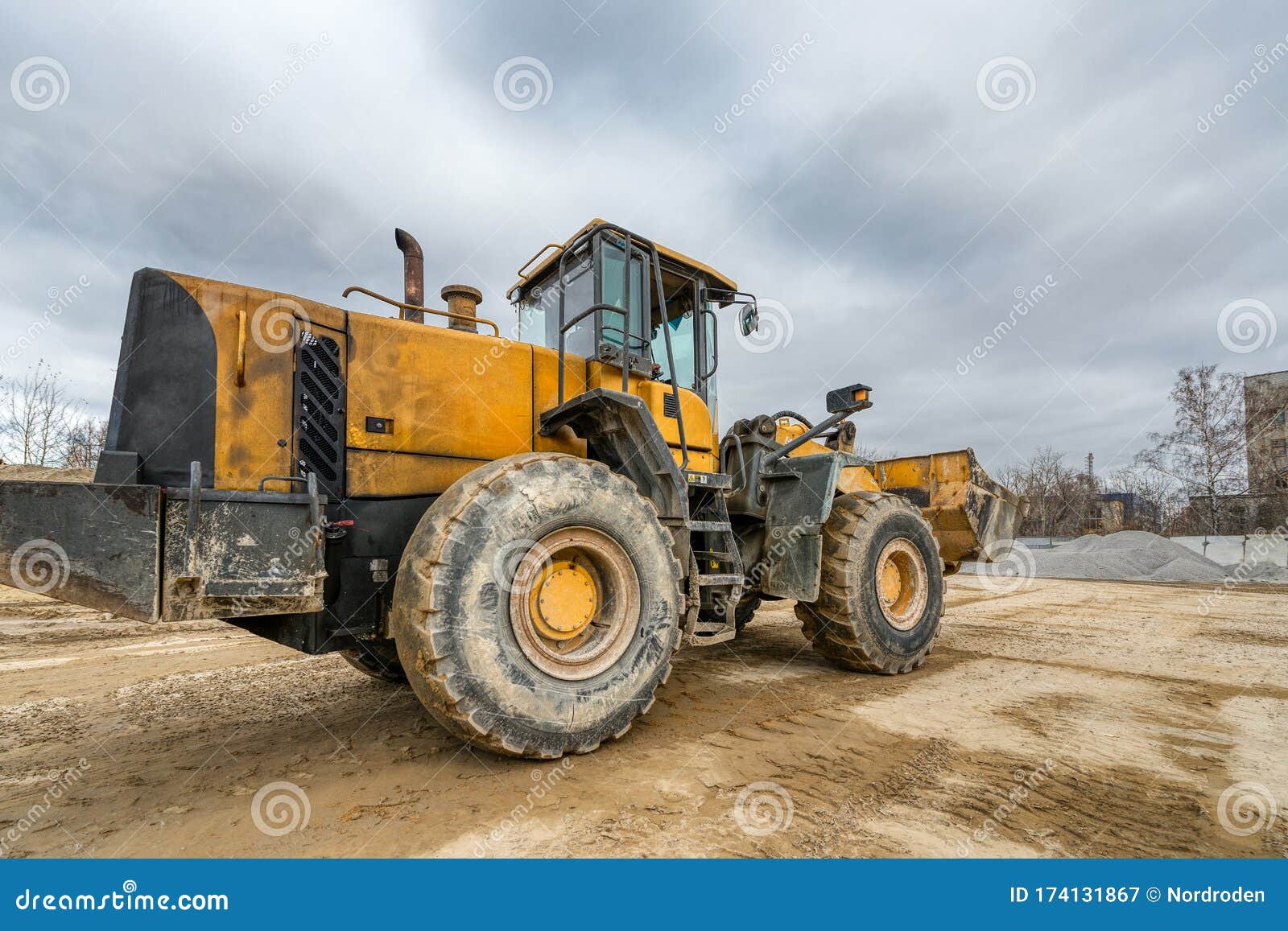 Wheel Loader Rides on a Construction Site. Stock Image - Image of ...