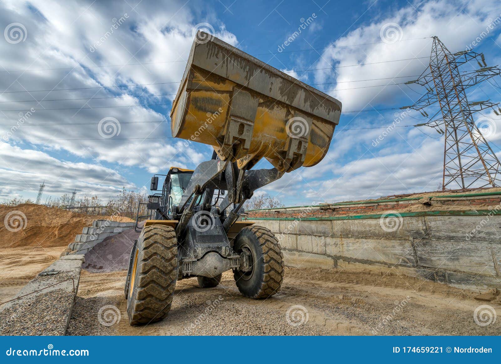 Wheel Loader Rides on a Construction Site. Stock Image - Image of ...