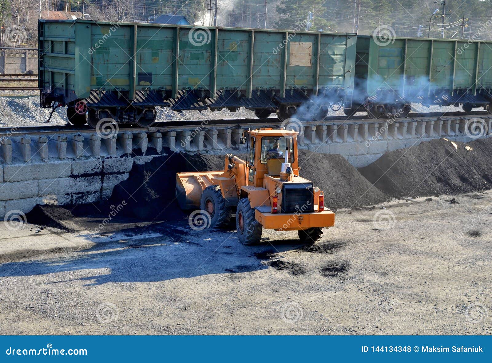 Loader Unload Coal at a Cargo Railway Station in a Mining Quarry Stock ...