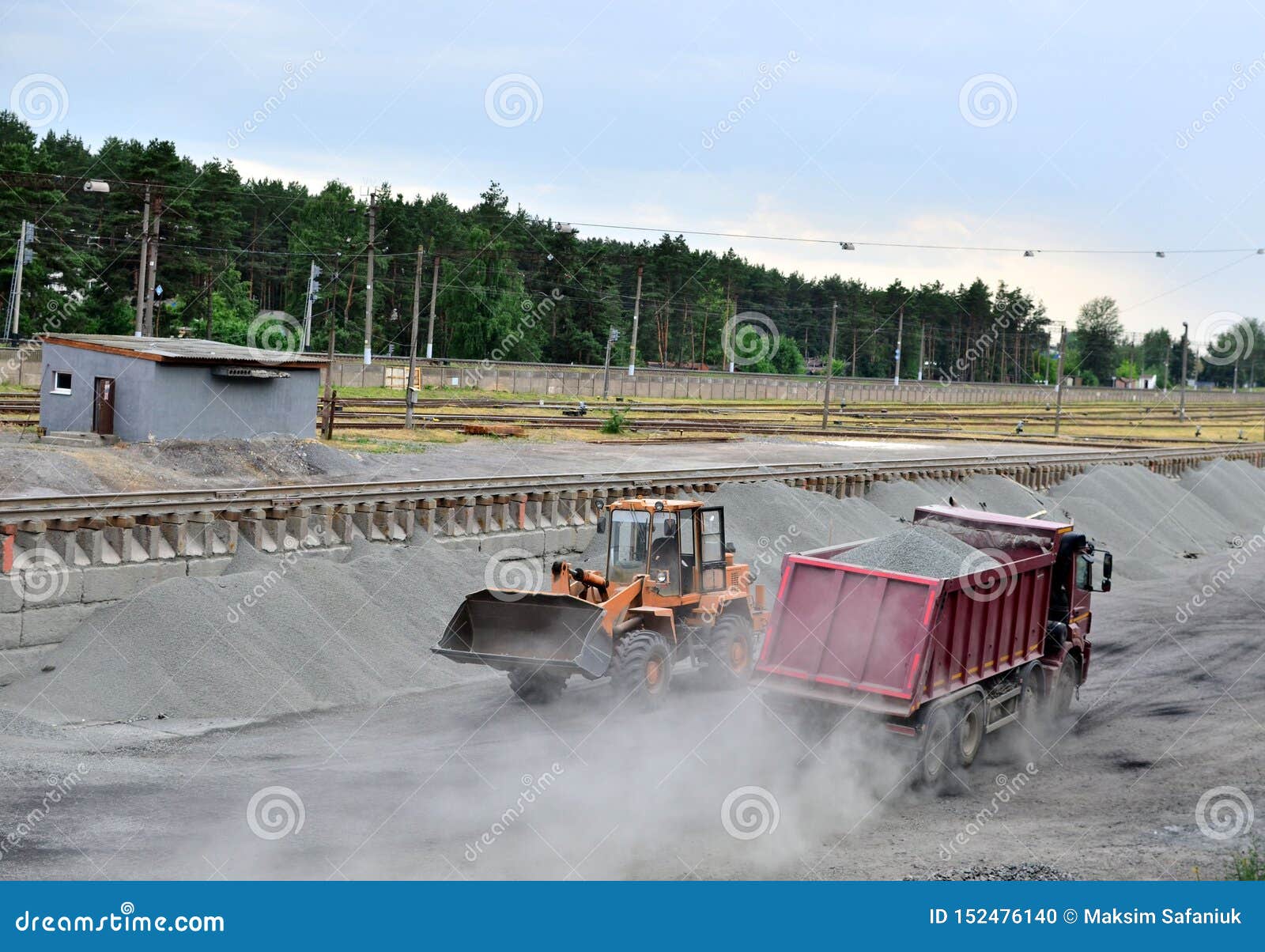 Unloading Bulk Cargo From Railway Wagons On Of High Railway Platform ...