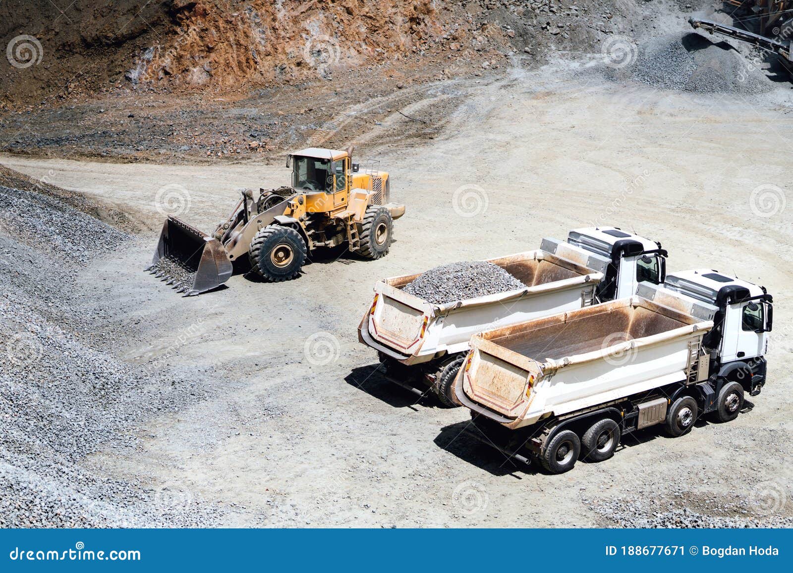 Wheel Loader Working on Site and Loading Dumper Trucks. Stock Image ...