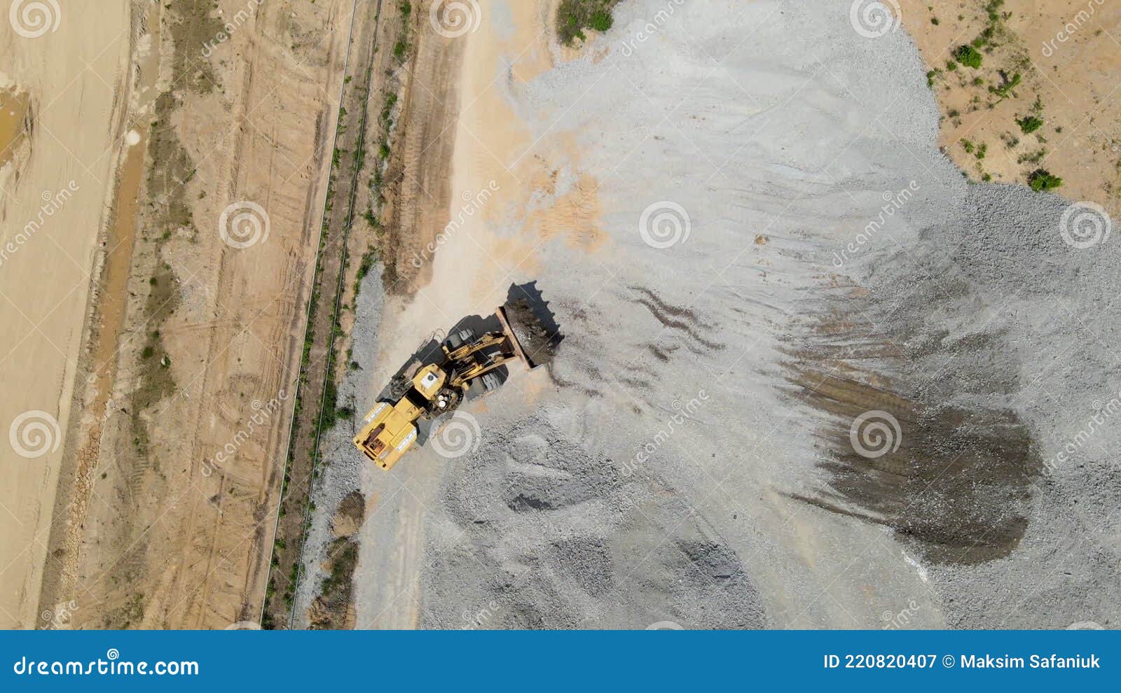 Wheel Loader Works in a Gravel Pit. Loading or Unloading Stone and ...