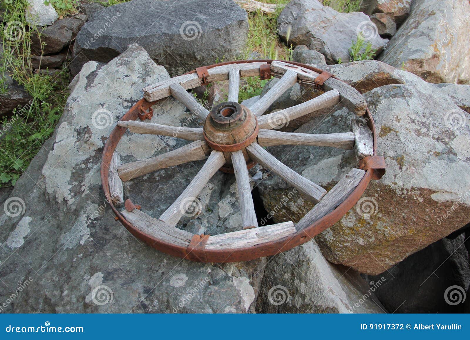 Wheel on the rock stock photo. Image of antique, rusty - 91917372