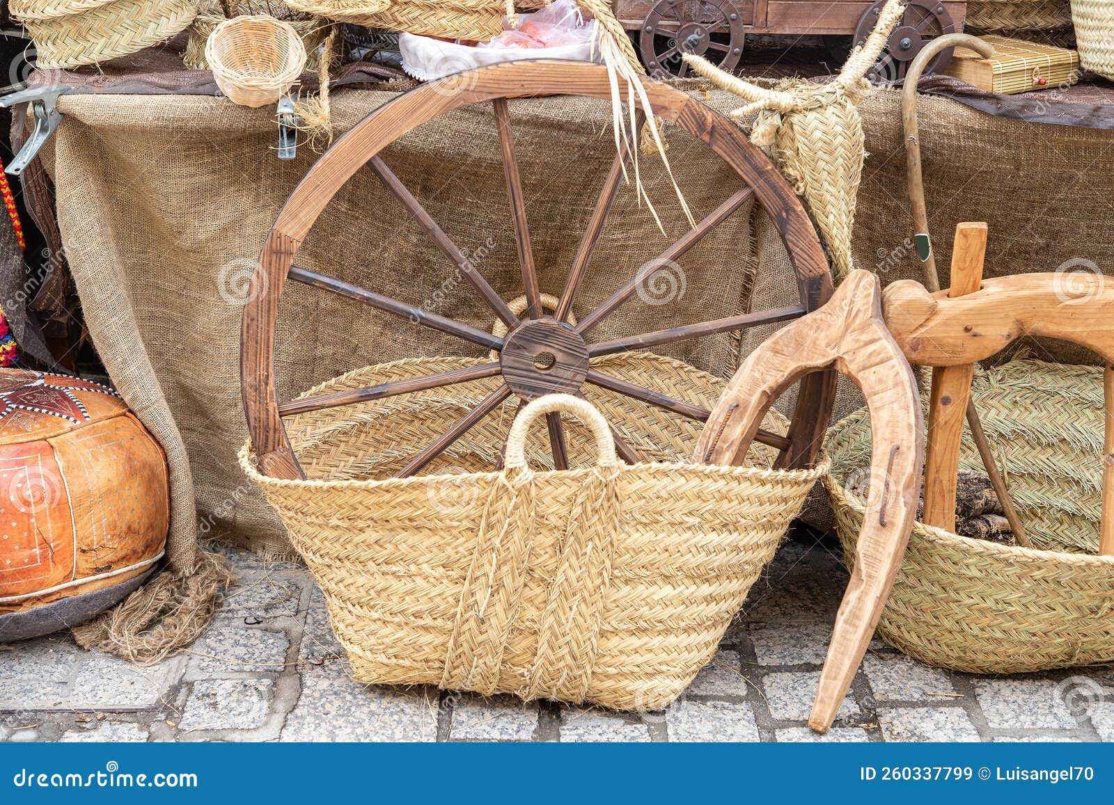 Wheel and Wooden Objects Inside Wicker Baskets Stock Image - Image of ...