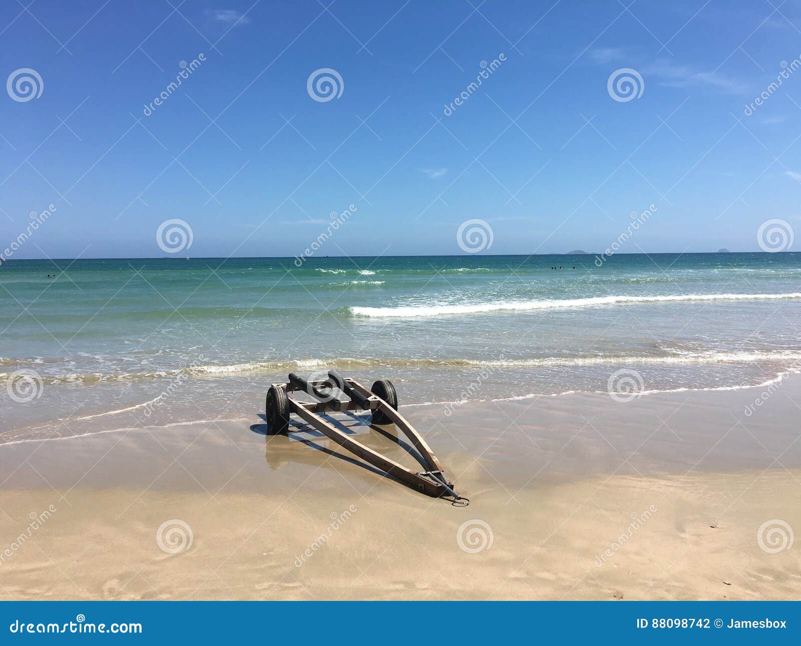 The Wheelbarrow on the Beach with Sea Wave Foam Stock Photo - Image of ...