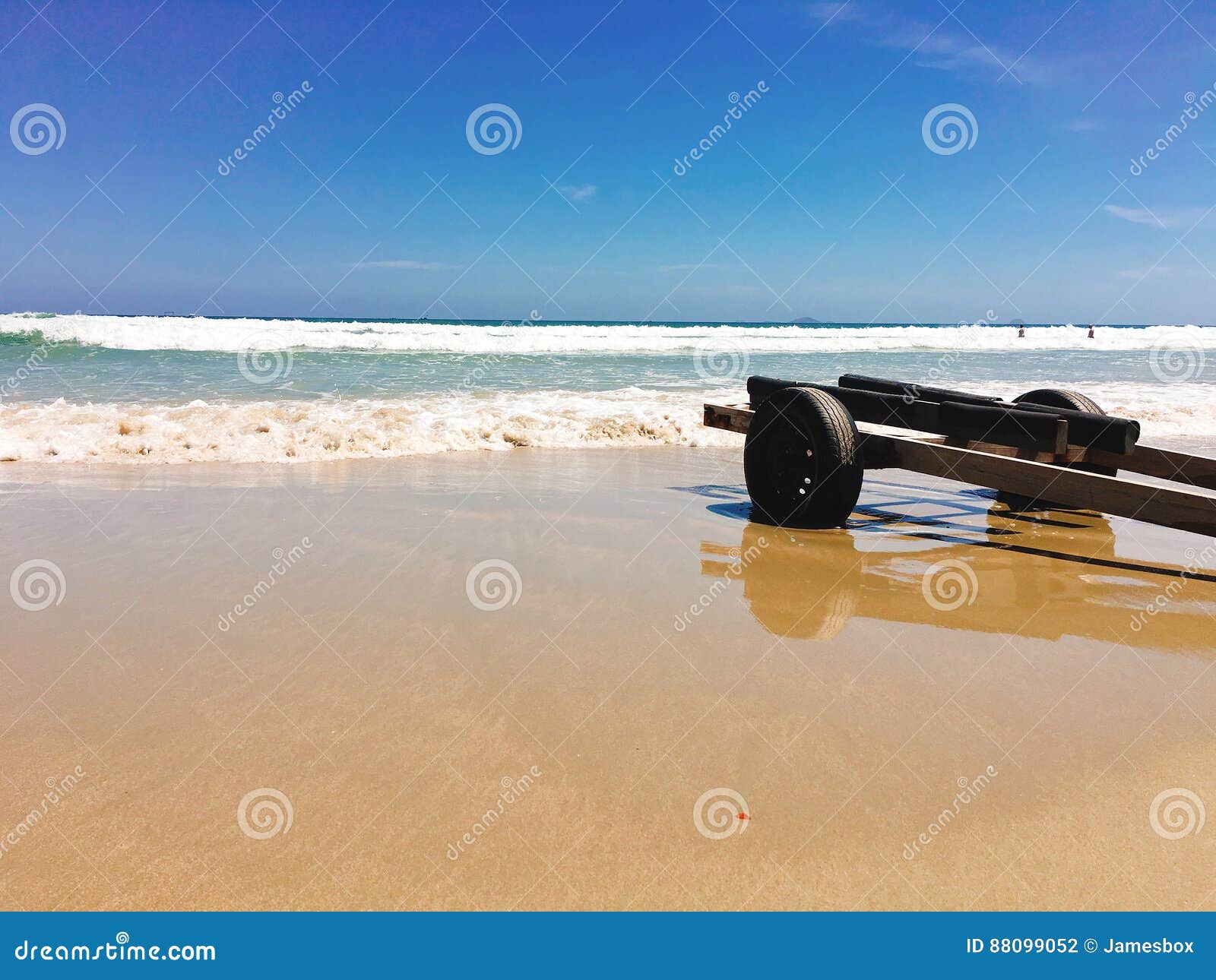 The Wheelbarrow on the Beach with Sea Wave Foam Stock Photo - Image of ...