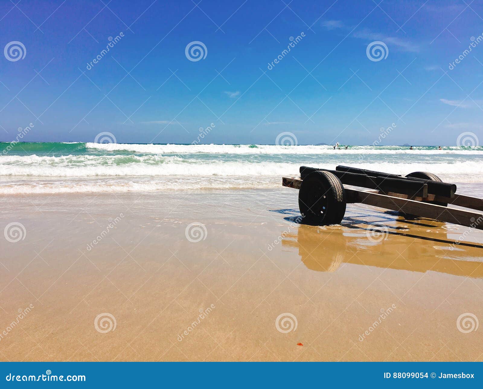 The Wheelbarrow on the Beach with Sea Wave Foam Stock Photo - Image of ...