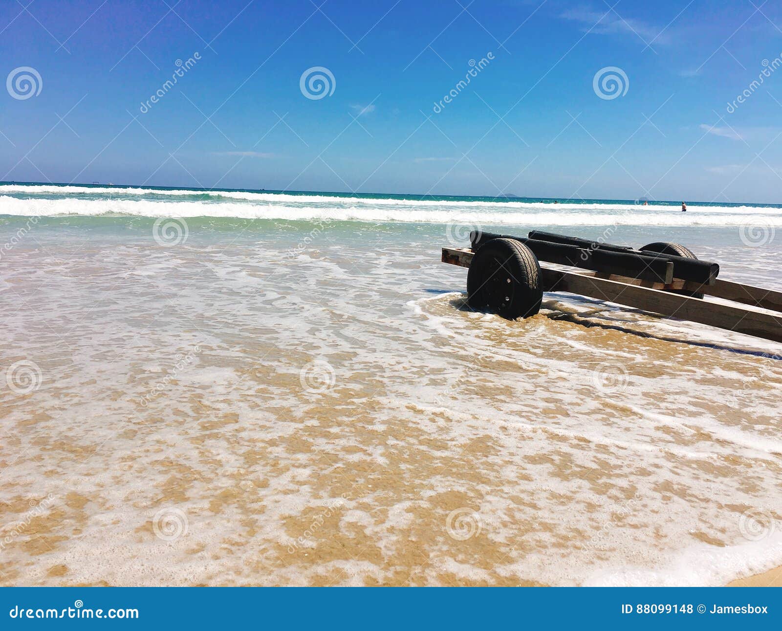 The Wheelbarrow on the Beach with Sea Wave Foam Stock Photo - Image of ...