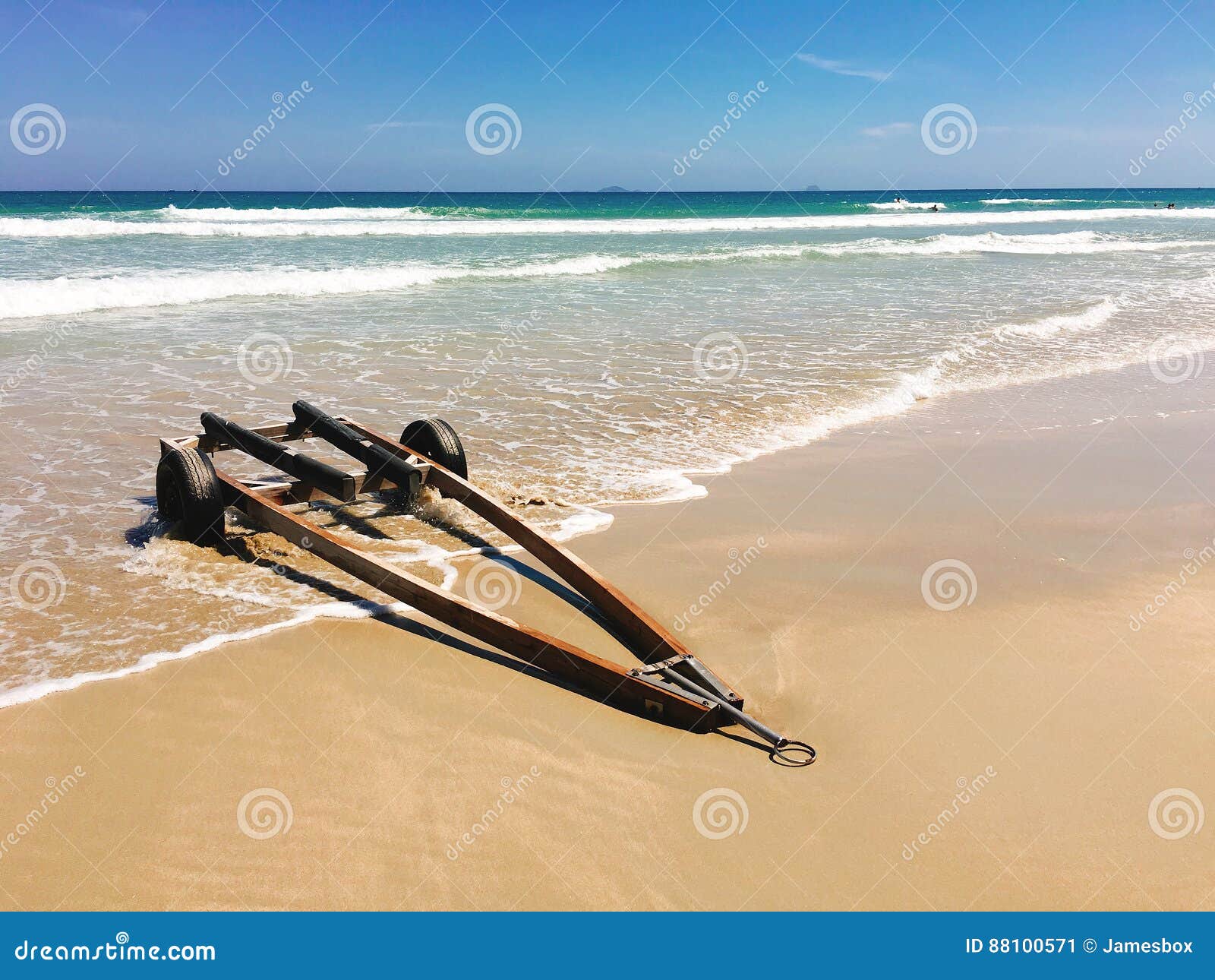 The Wheelbarrow on the Beach with Sea Wave Foam Stock Image - Image of ...