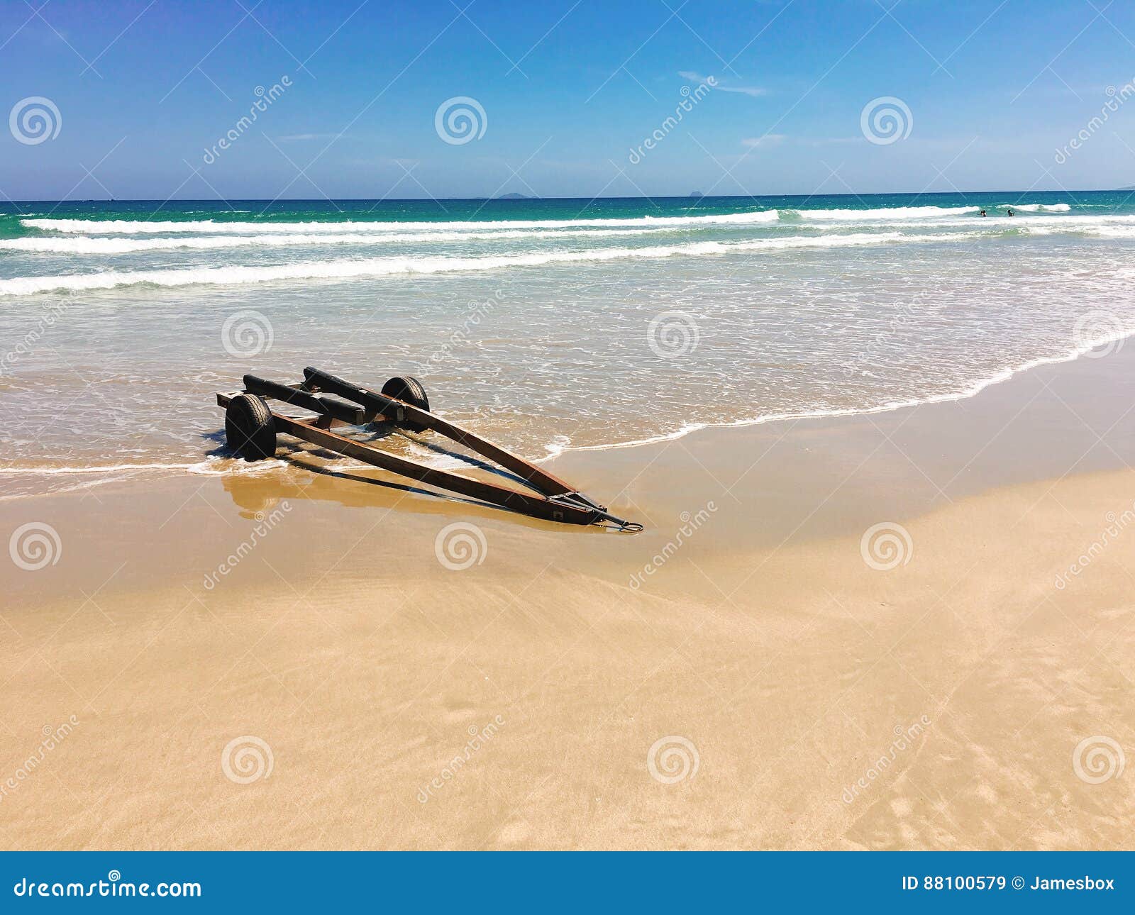 The Wheelbarrow on the Beach with Sea Wave Foam Stock Image - Image of ...