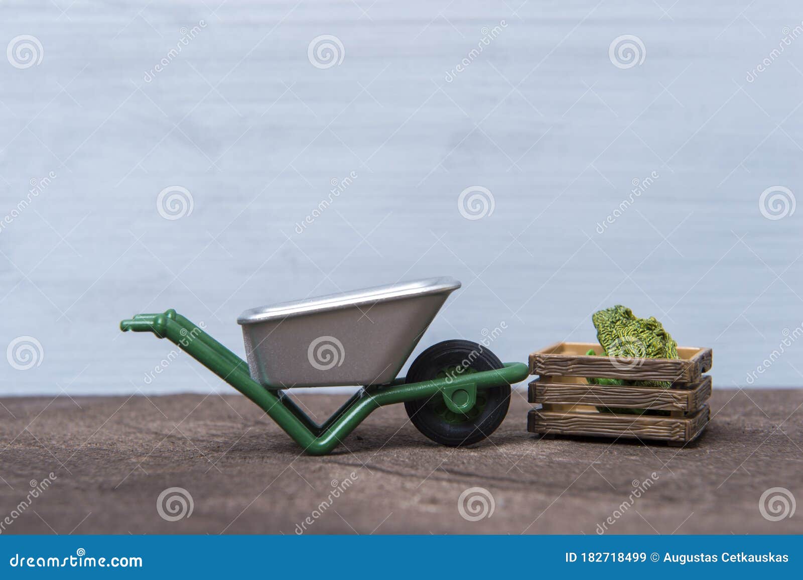 Wheelbarrow and Box on Grey Background Stock Image - Image of isolated ...