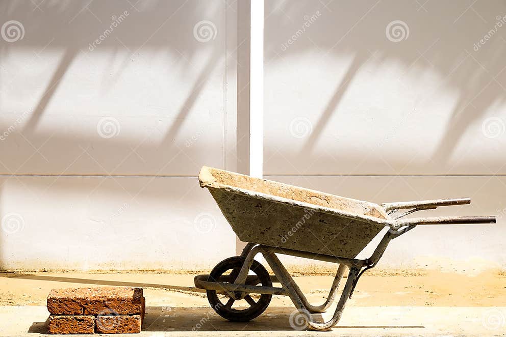 The wheelbarrow and bricks stock photo. Image of skill - 63919250