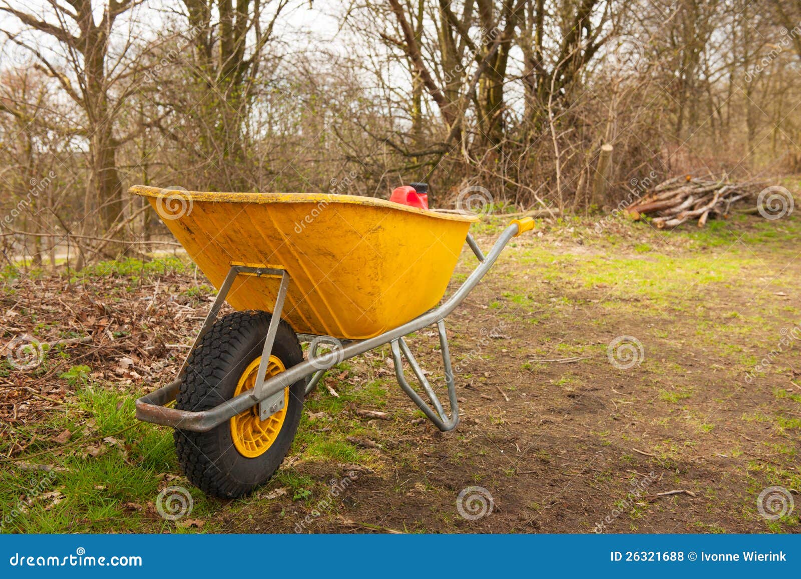 Wheelbarrow in the forest stock photo. Image of working - 26321688