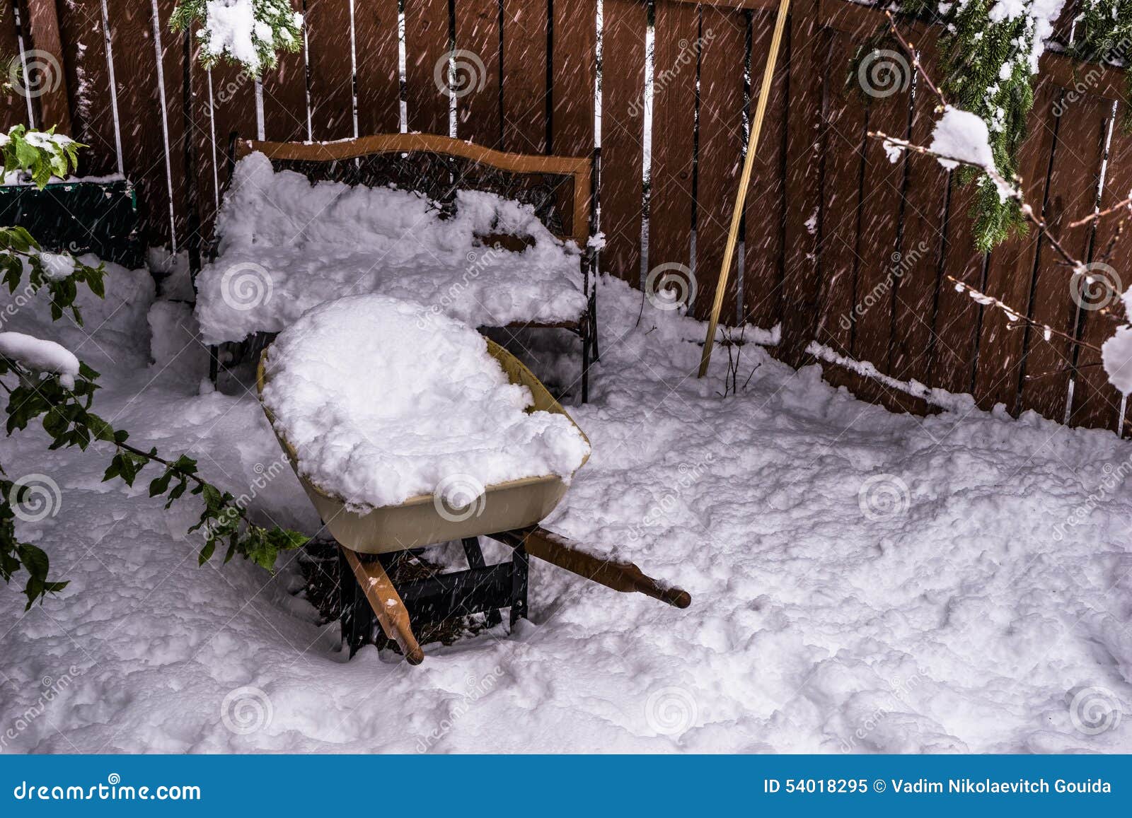 Wheelbarrow and fresh snow stock image. Image of bench - 54018295