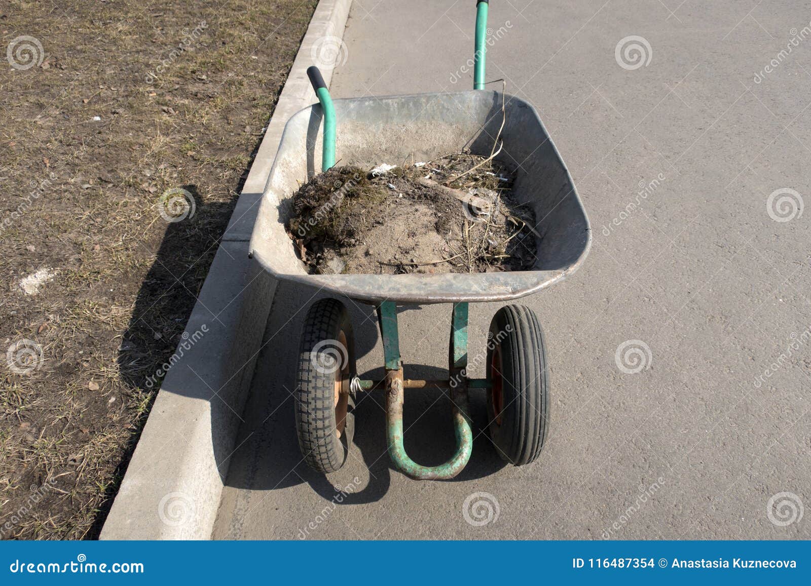 Wheelbarrow with garbage stock photo. Image of plants - 116487354
