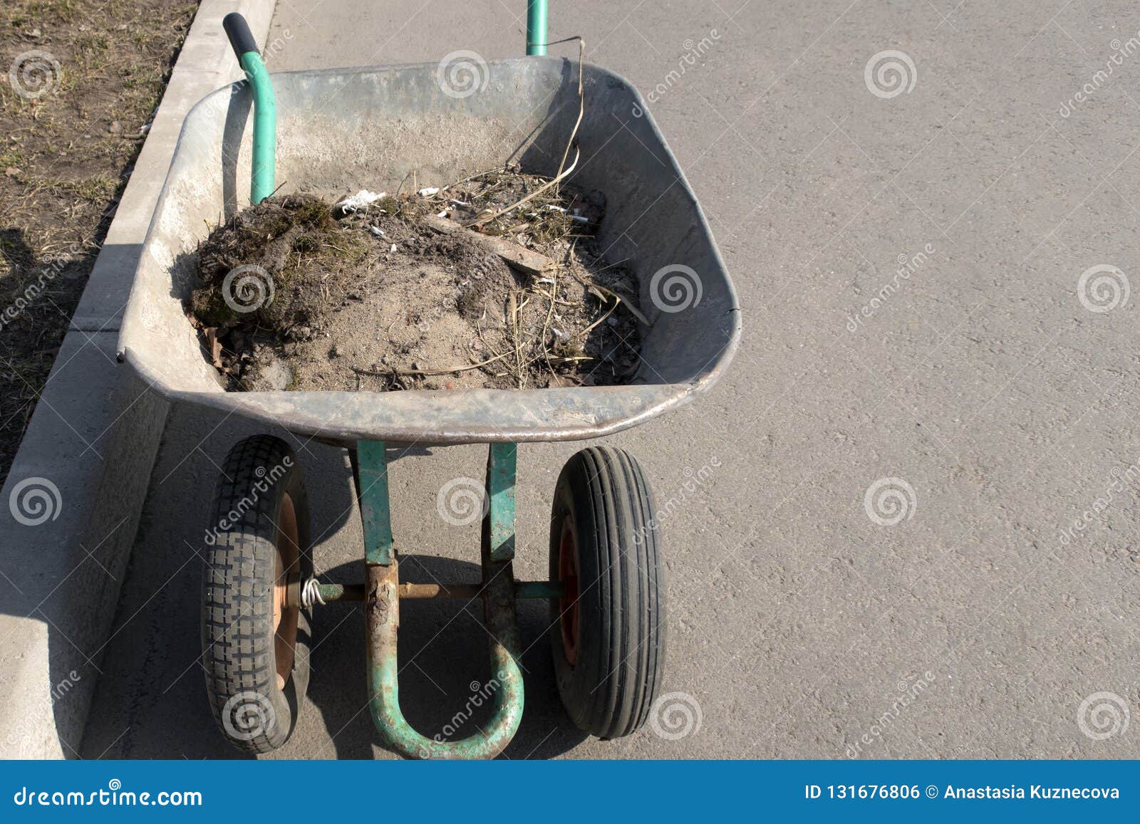 Wheelbarrow with garbage stock photo. Image of transportation - 131676806