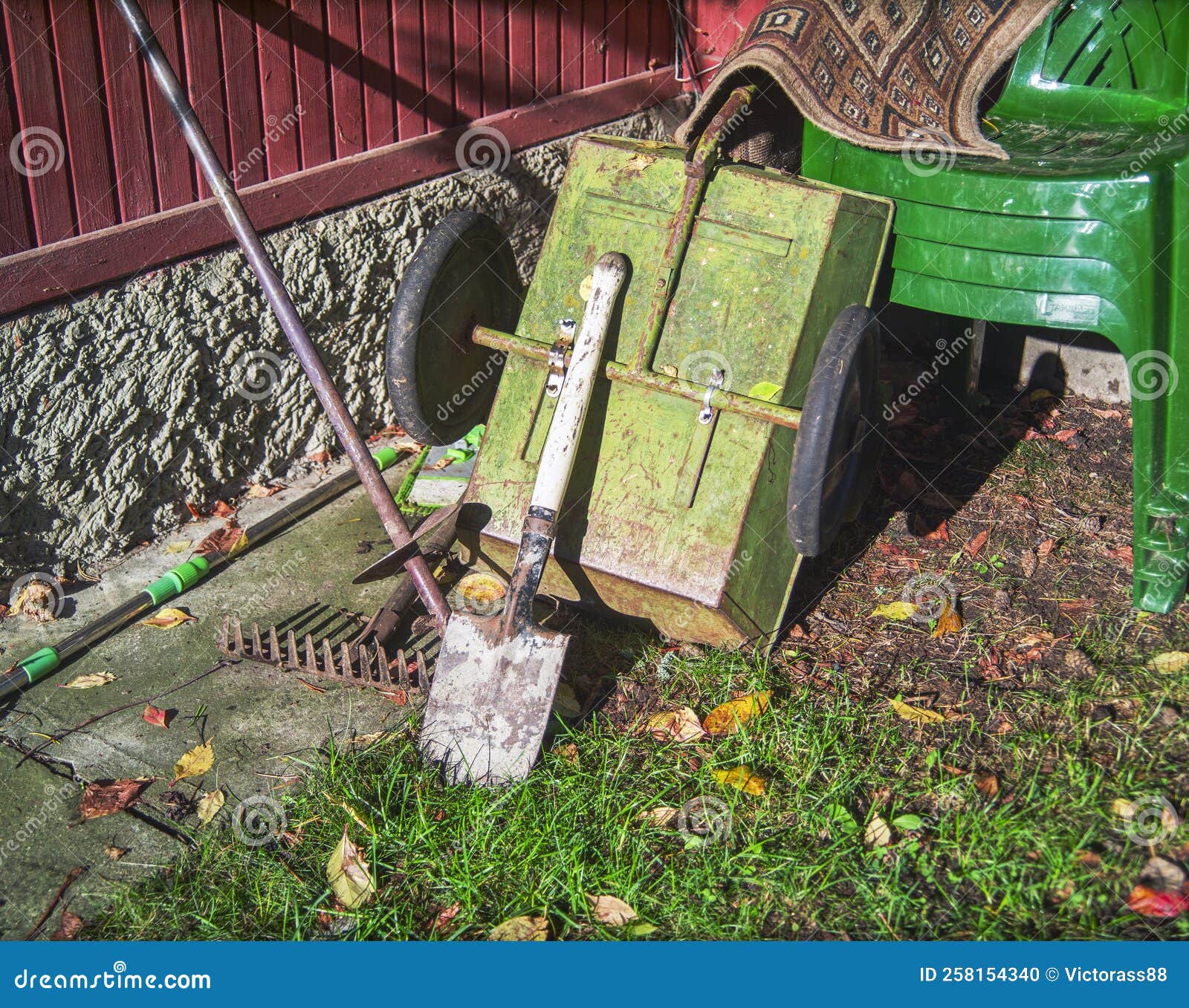 Wheelbarrow and hand-tools stock photo. Image of shovel - 258154340