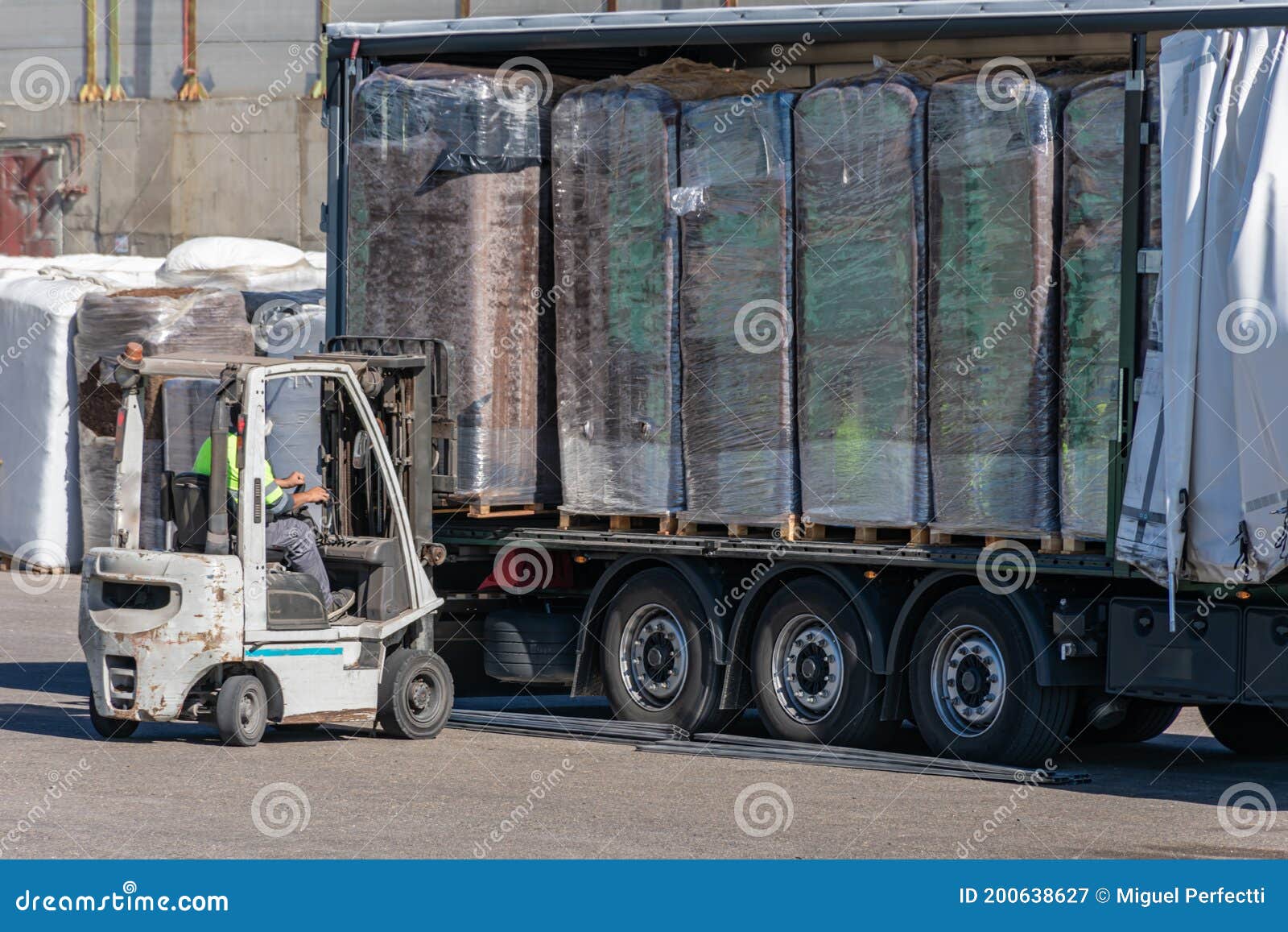 Wheelbarrow Loading a Peat Pallet Editorial Photography - Image of ...