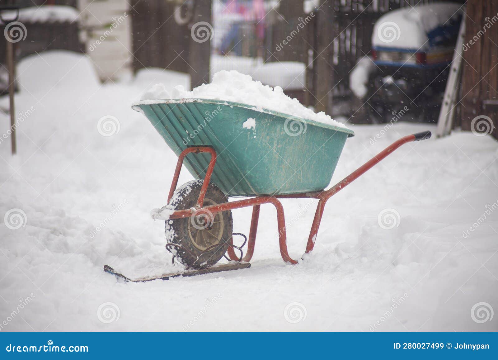 Wheelbarrow with snow stock image. Image of watering - 280027499