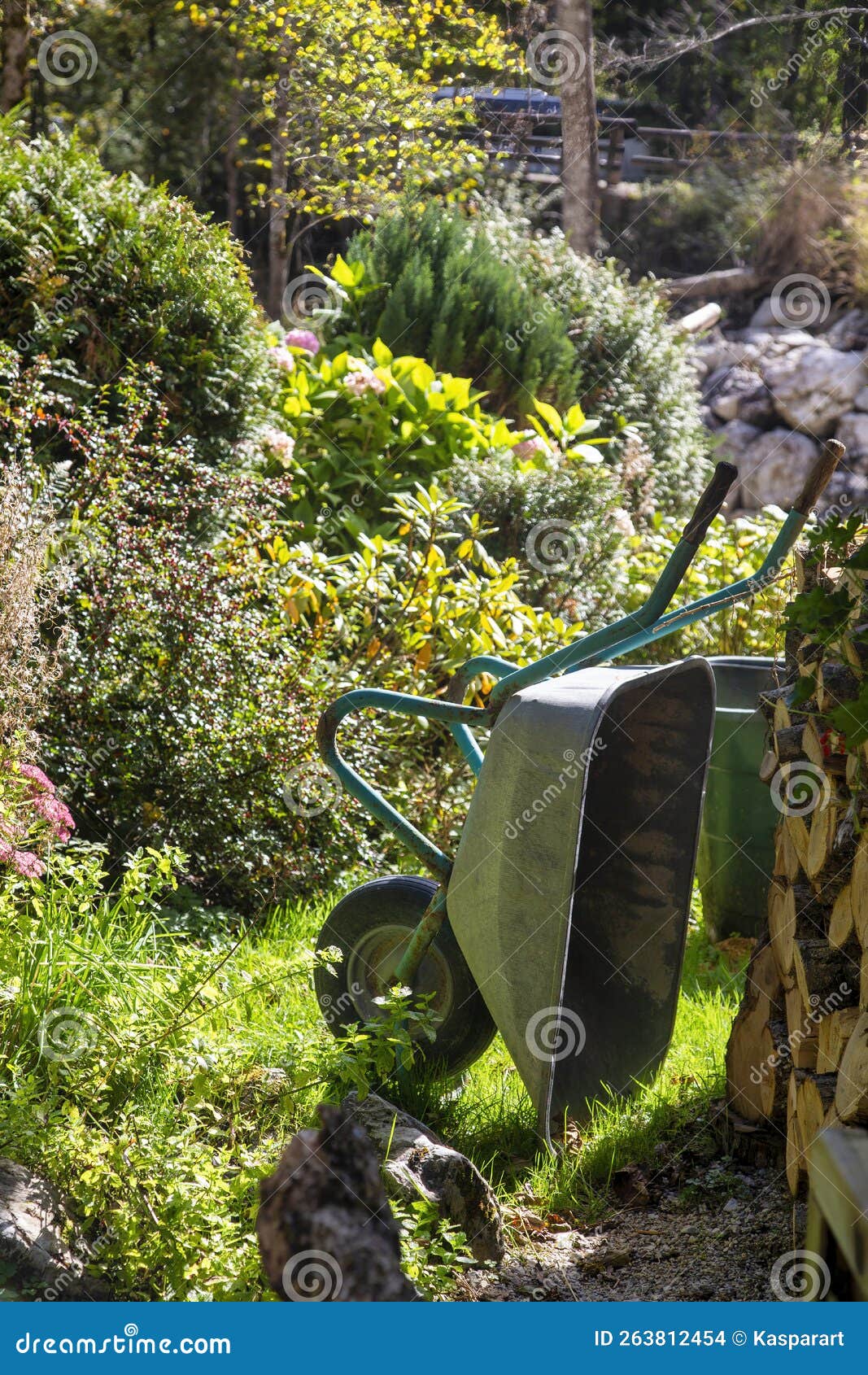 A Wheelbarrow Standing in the Garden Stock Photo - Image of landscape ...