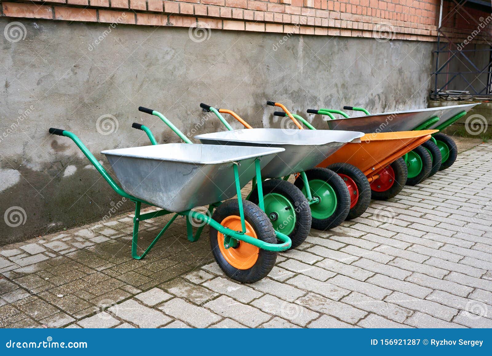 Wheelbarrows stock image. Image of garden, wooden, wheel - 156921287 Wheelbarrows stock image. Image of garden, wooden, wheel - 156921287