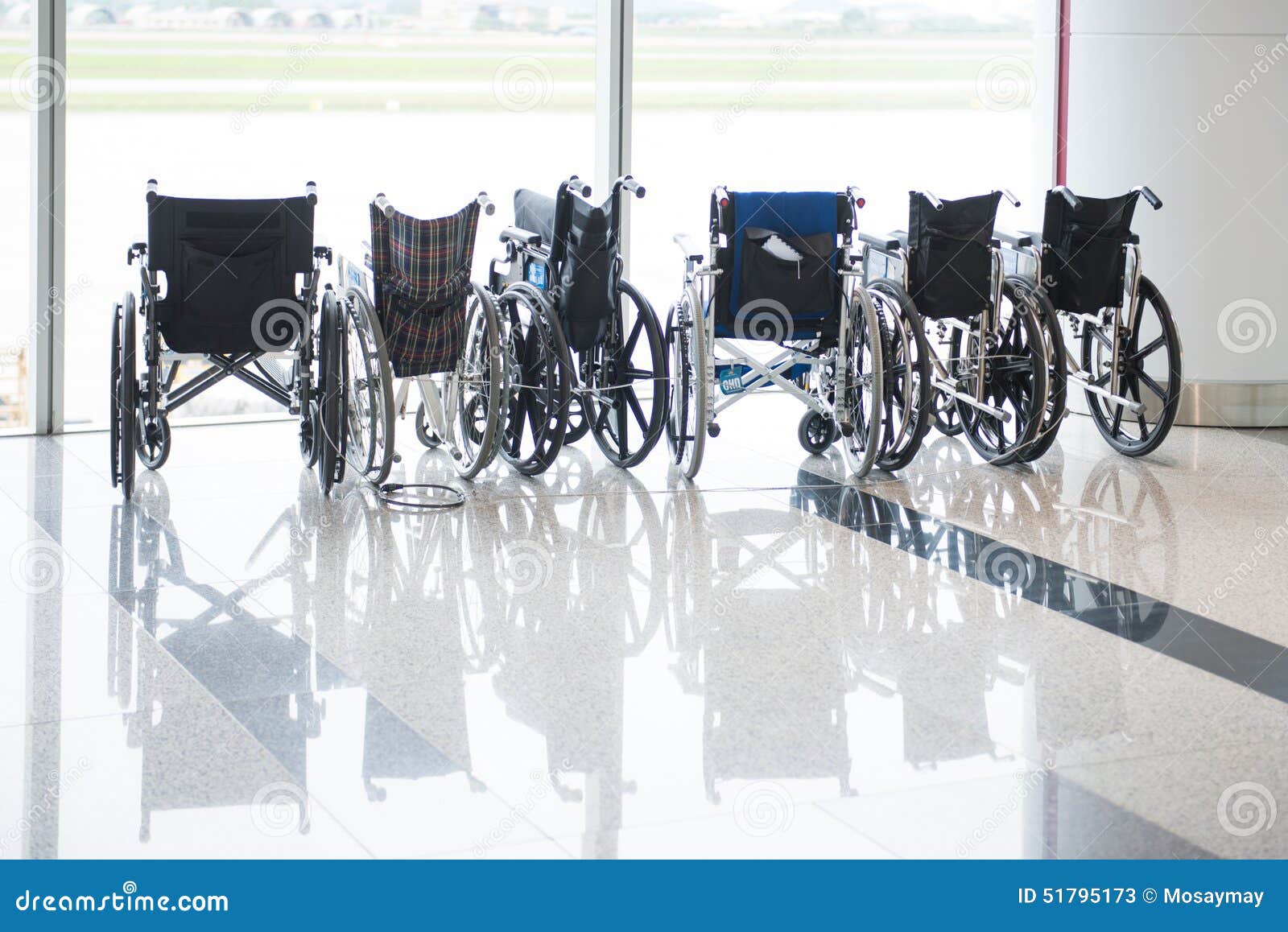 Wheelchairs for Elderly and Disabled Passengers at the Airport Stock ...