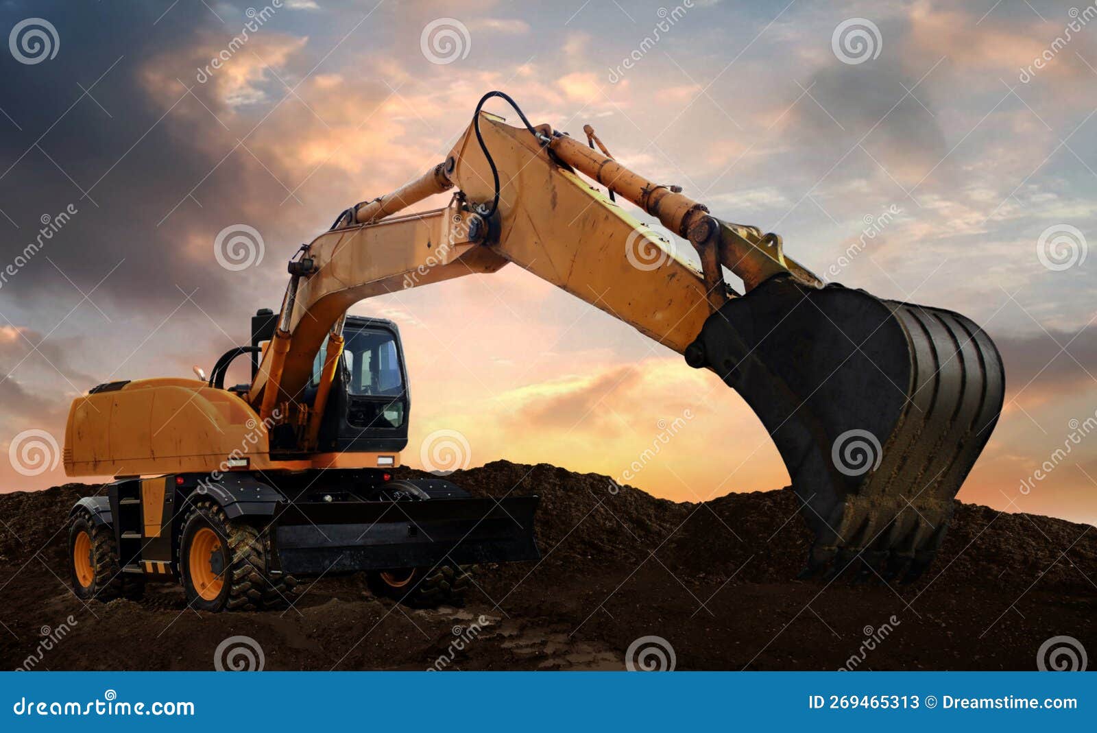 Wheeled Excavator at Work Digging Soil during Sunset Stock Image ...