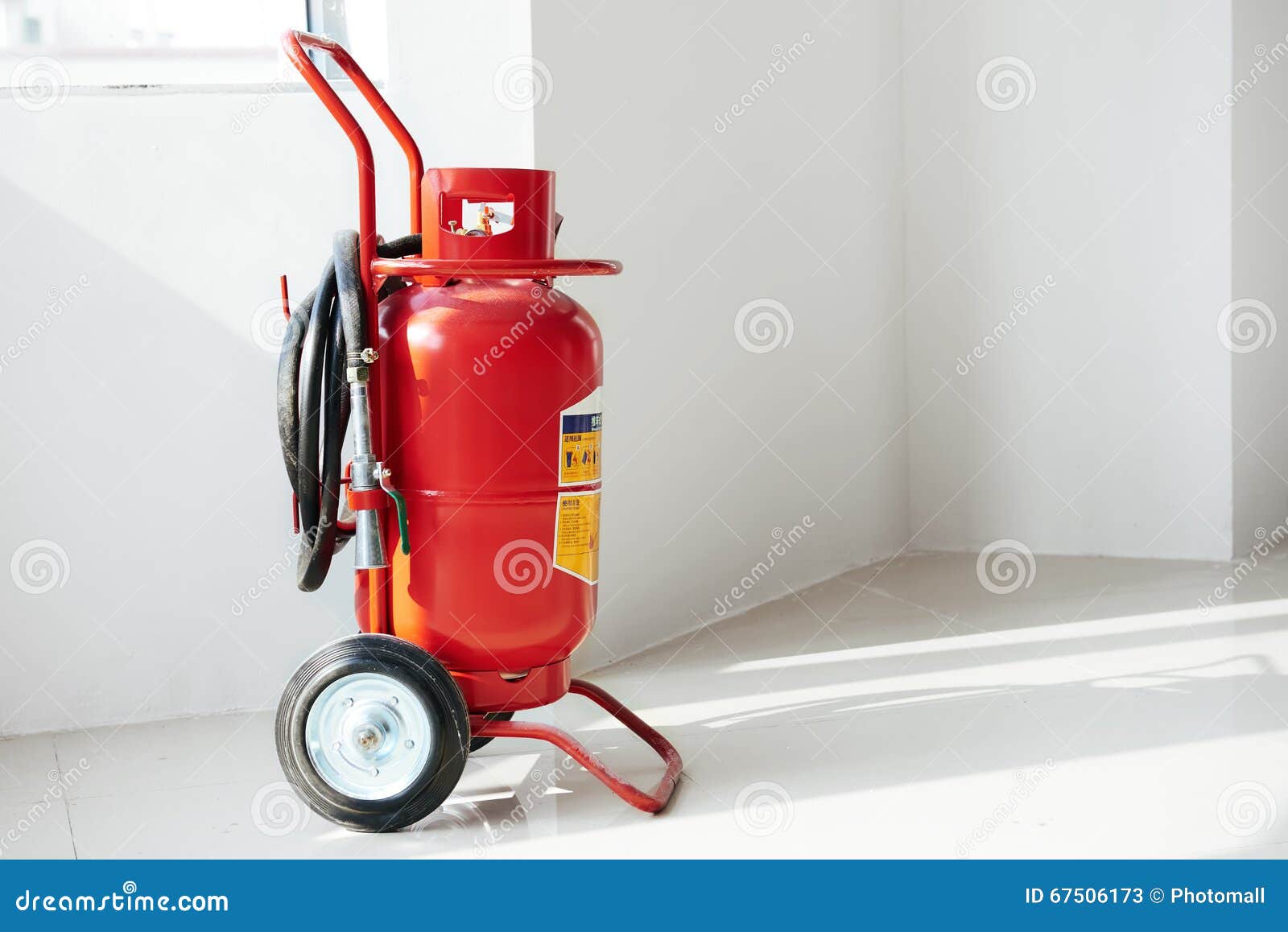 Wheeled fire extinguisher stock image. Image of auto - 67506173