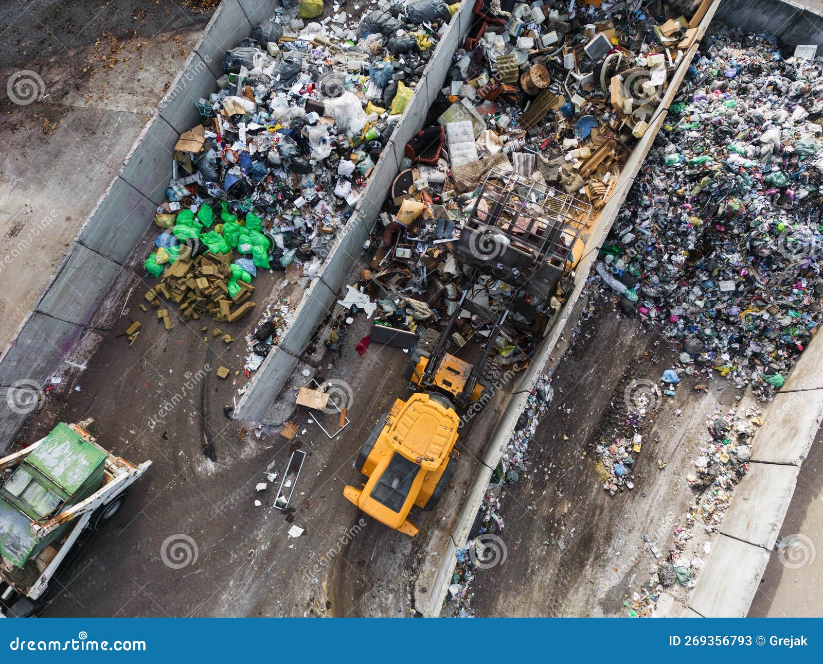 Wheeled Loader Loading a Bucket with Garbage at a Landfill Stock Image ...
