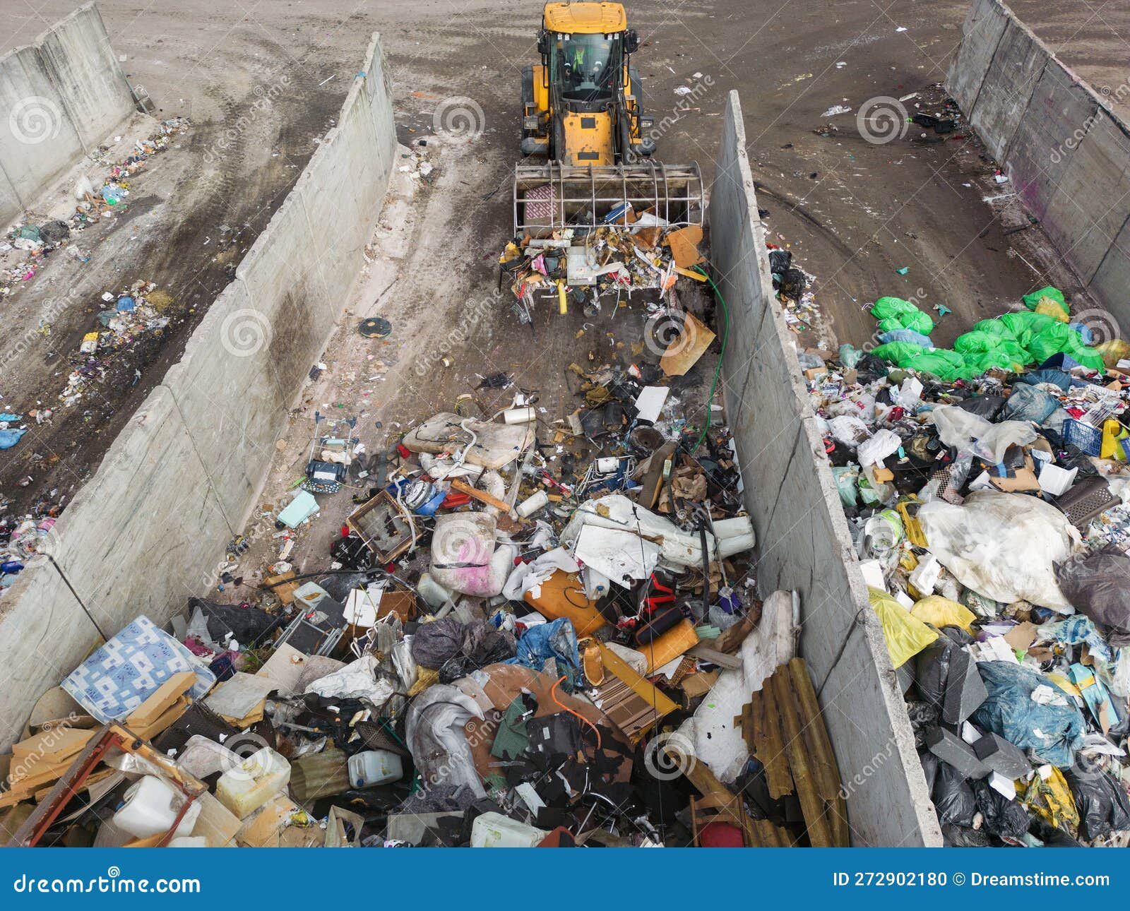 Wheeled Loader Loading a Bucket with Garbage at a Landfill Stock Photo ...