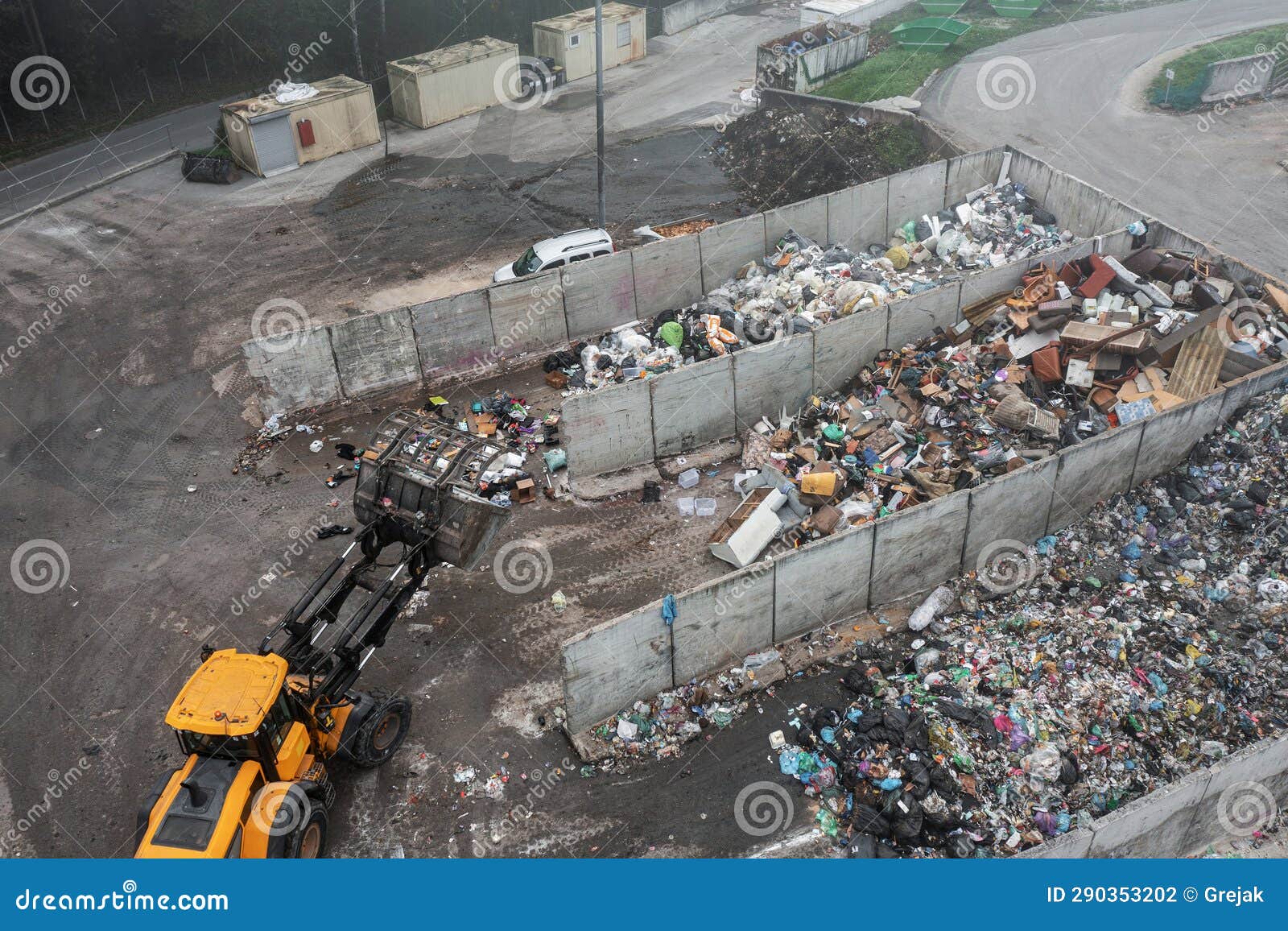 Wheeled Loader Loading a Bucket with Garbage at a Landfill Stock Photo ...