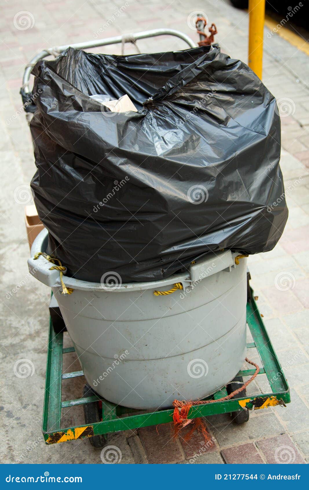 A Wheelie-bin with a Black Plastic Trash Bag Stock Photo - Image of ...