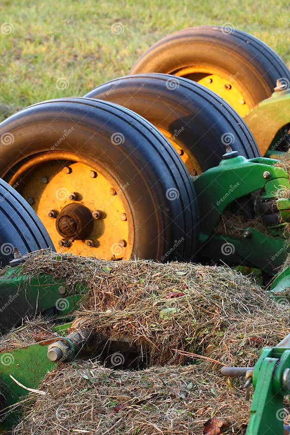 Wheels on farm equipment. stock image. Image of grass - 3578253