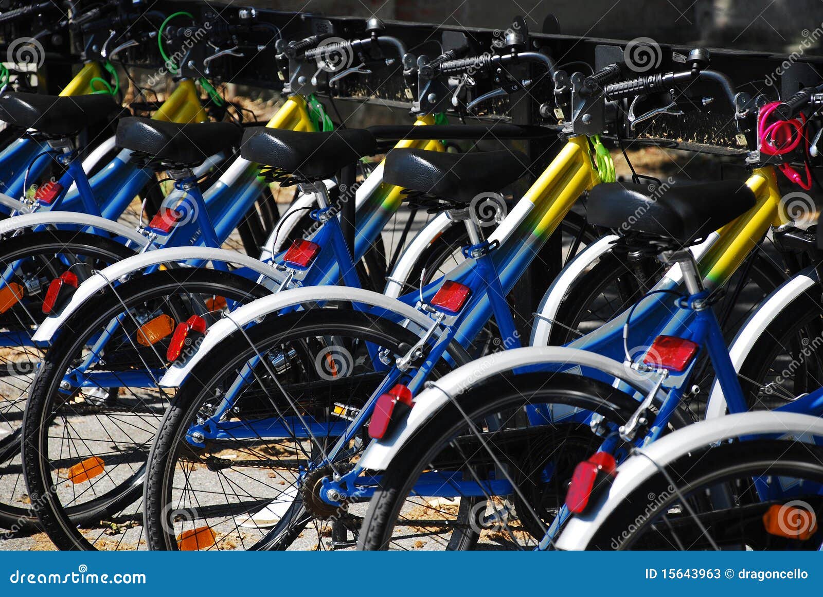 Wheels on a Row of Bikes stock image. Image of sadles - 15643963