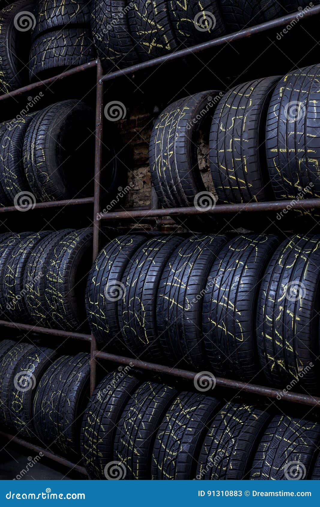 Wheels stacked in a Garage stock image. Image of black - 91310883