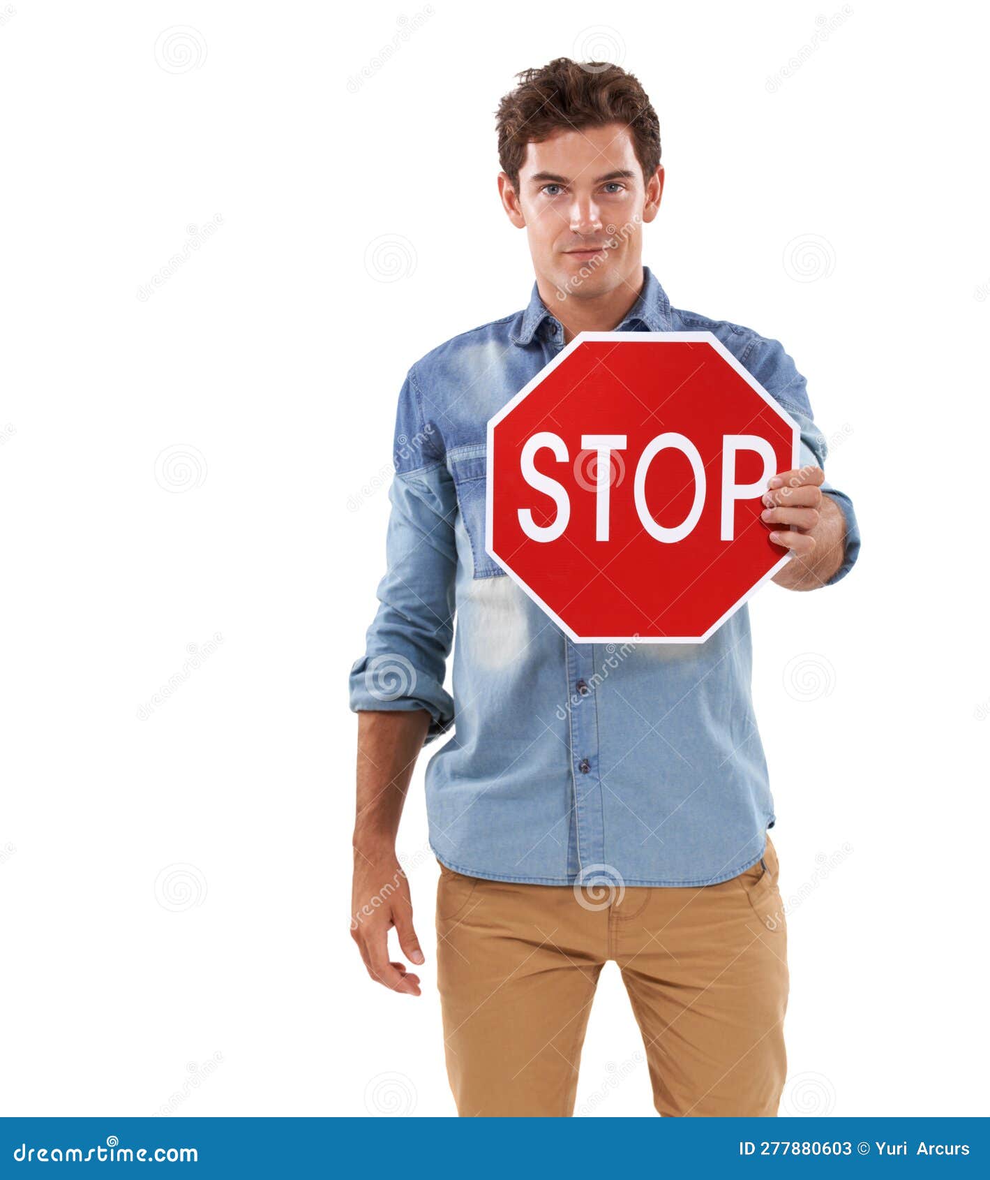 This is Where it Ends. a Casual Young Man Holding Up a Stop Sign. Stock ...