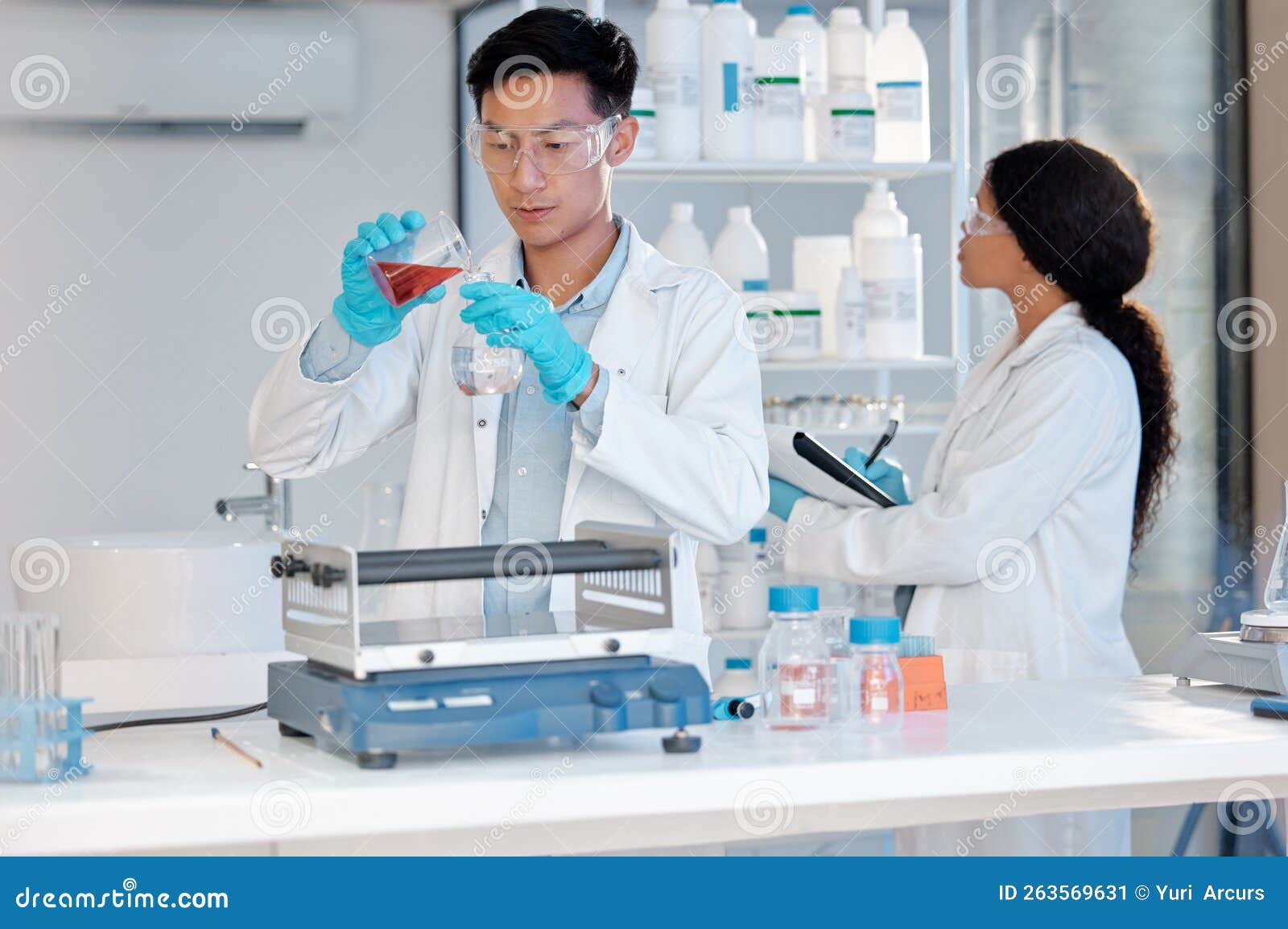 This is Where the Hard Work Happens. a Young Male Lab Tech Filling ...