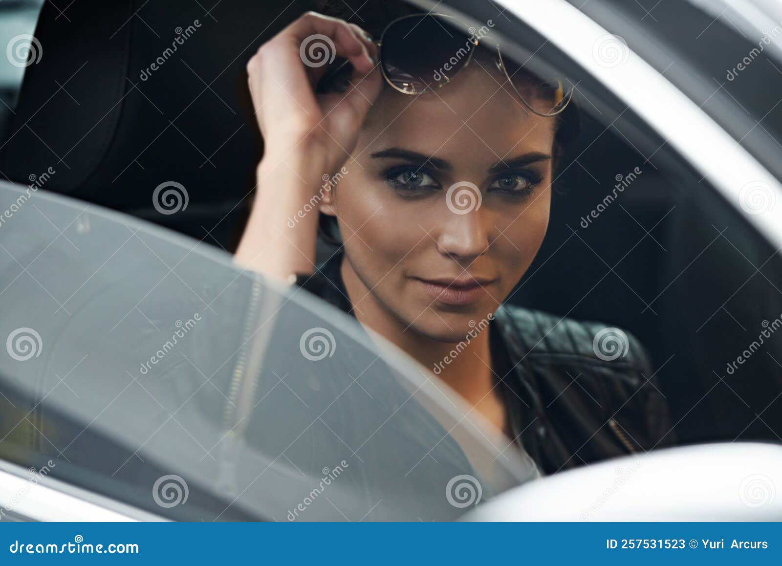 Where To Go...an Attractive Young Driver Looking through the Front ...