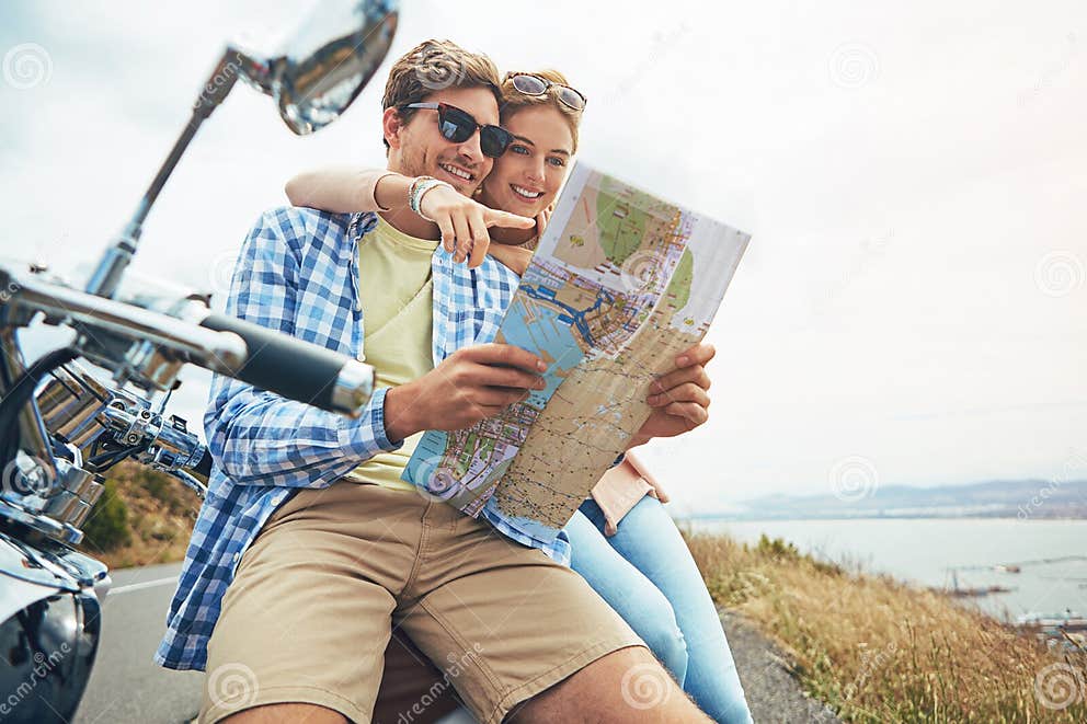 Wheres Our Next Stop. a Couple Using a Map while Out on a Road Trip ...